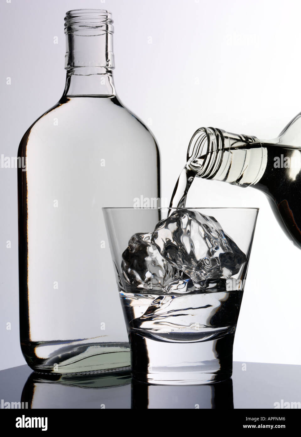 POURING GLASS OF GIN Stock Photo - Alamy