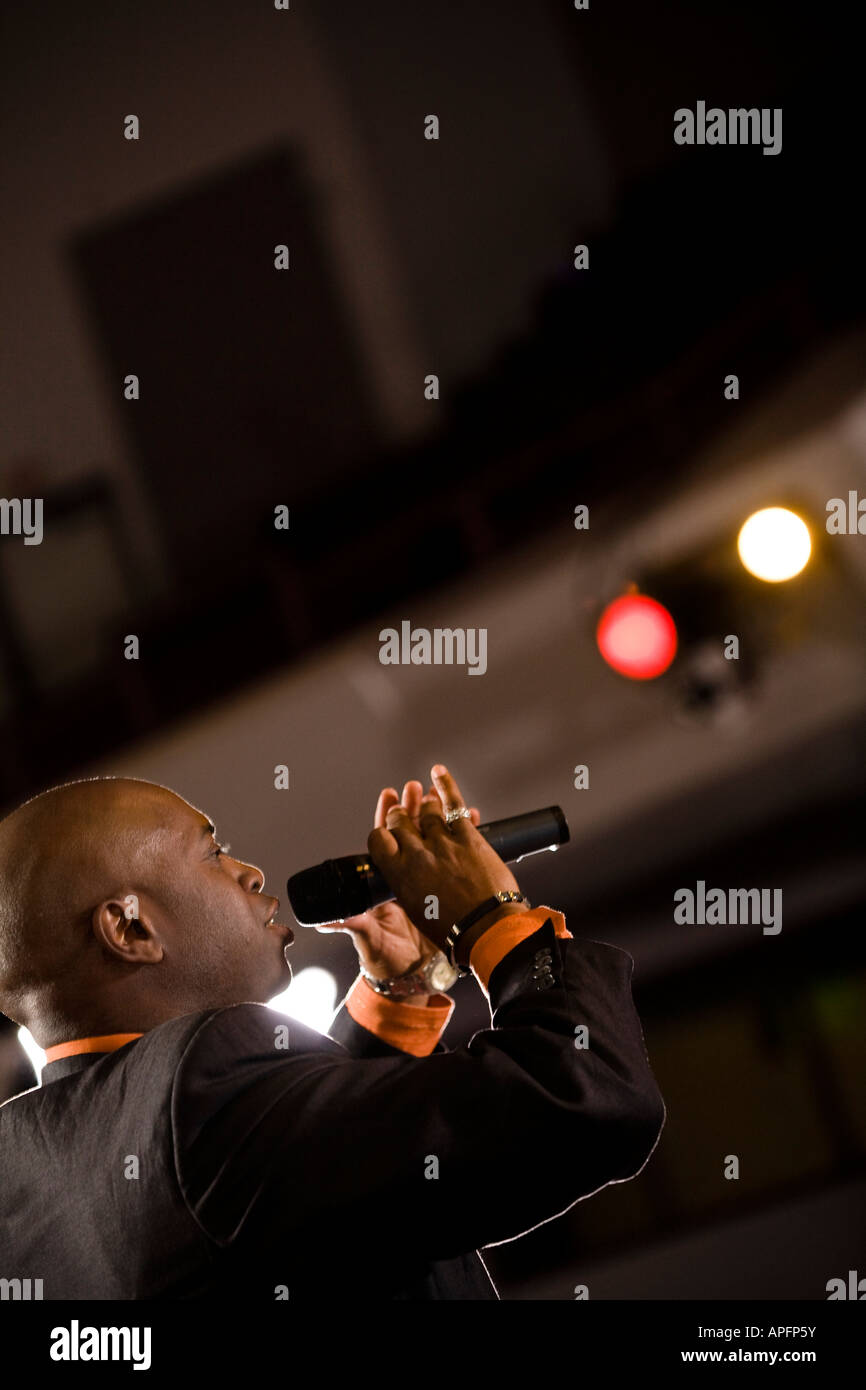 Man speaking into microphone Stock Photo - Alamy