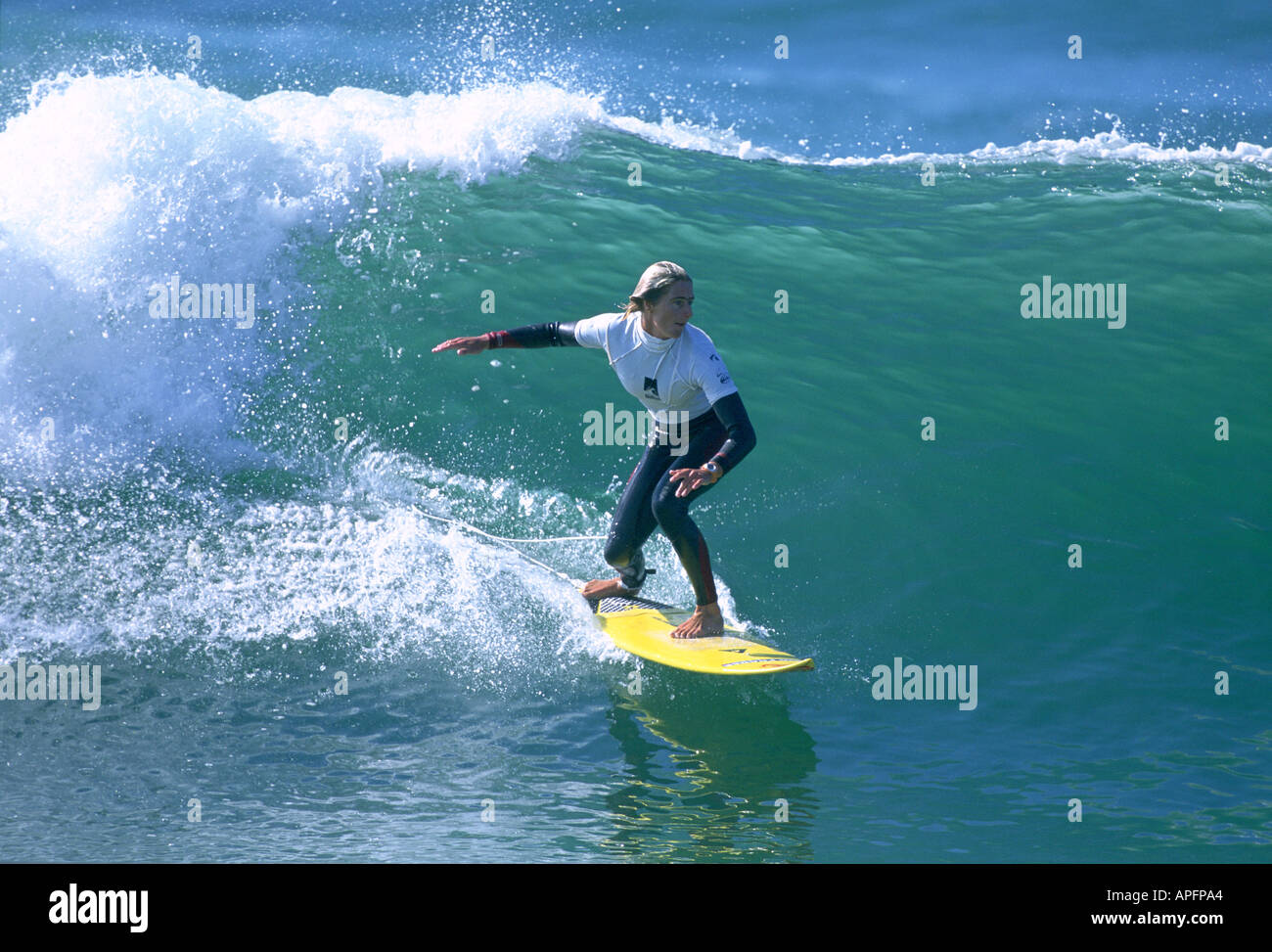 SURFING GIRL ACTION Stock Photo - Alamy
