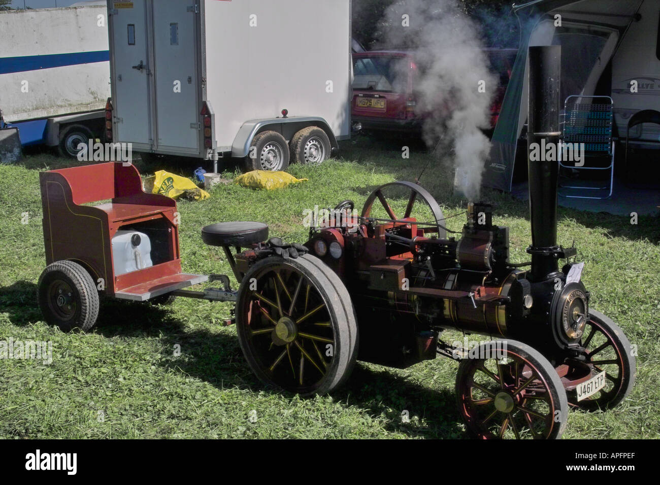 Miniature working model steam engine with trailer Stock Photo - Alamy