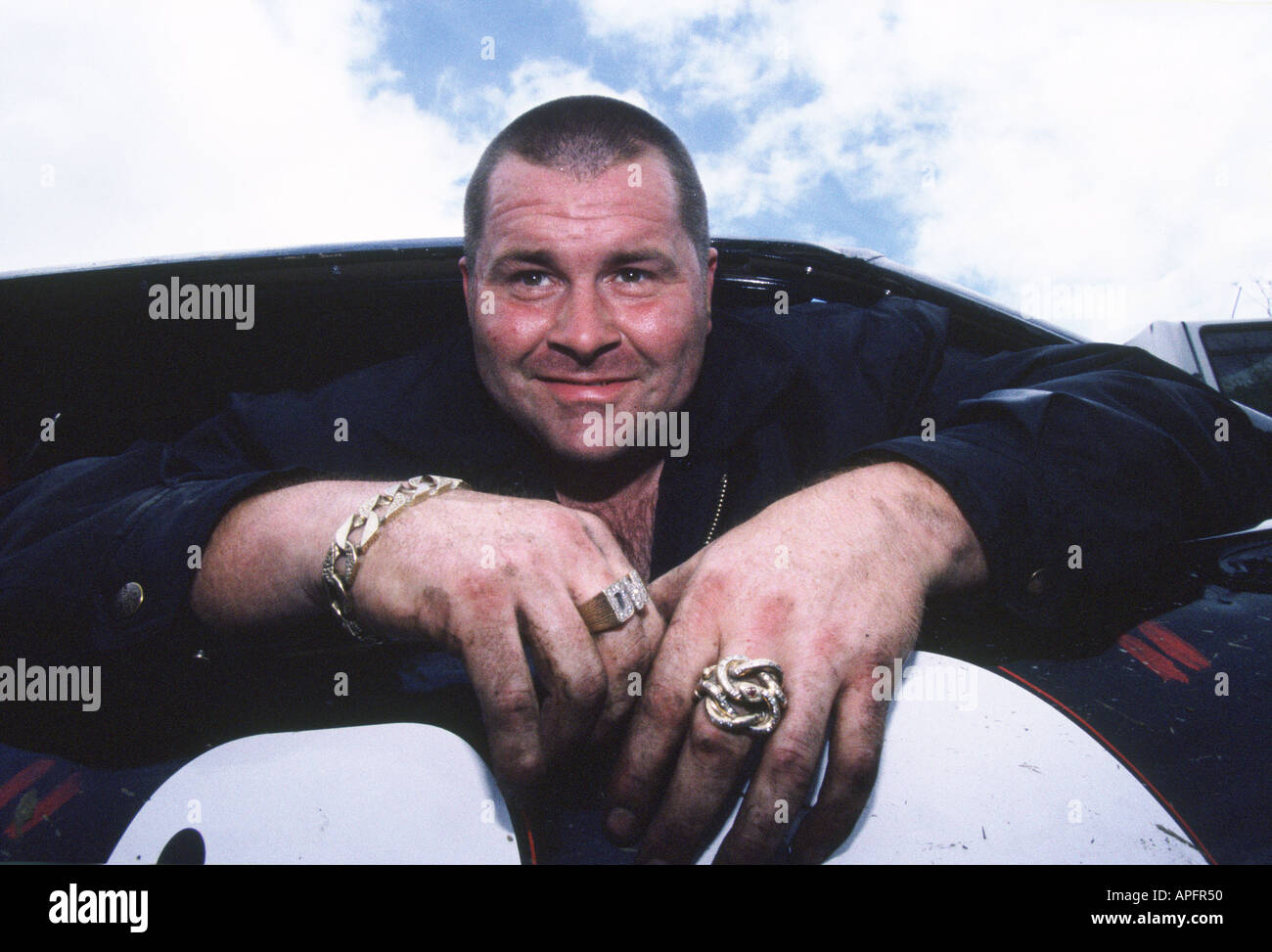 Stock car racer smiling portrait with rings Stock Photo - Alamy