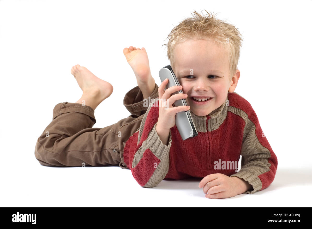 Little boy on the phone calling his grandpa Isolated on white Stock ...