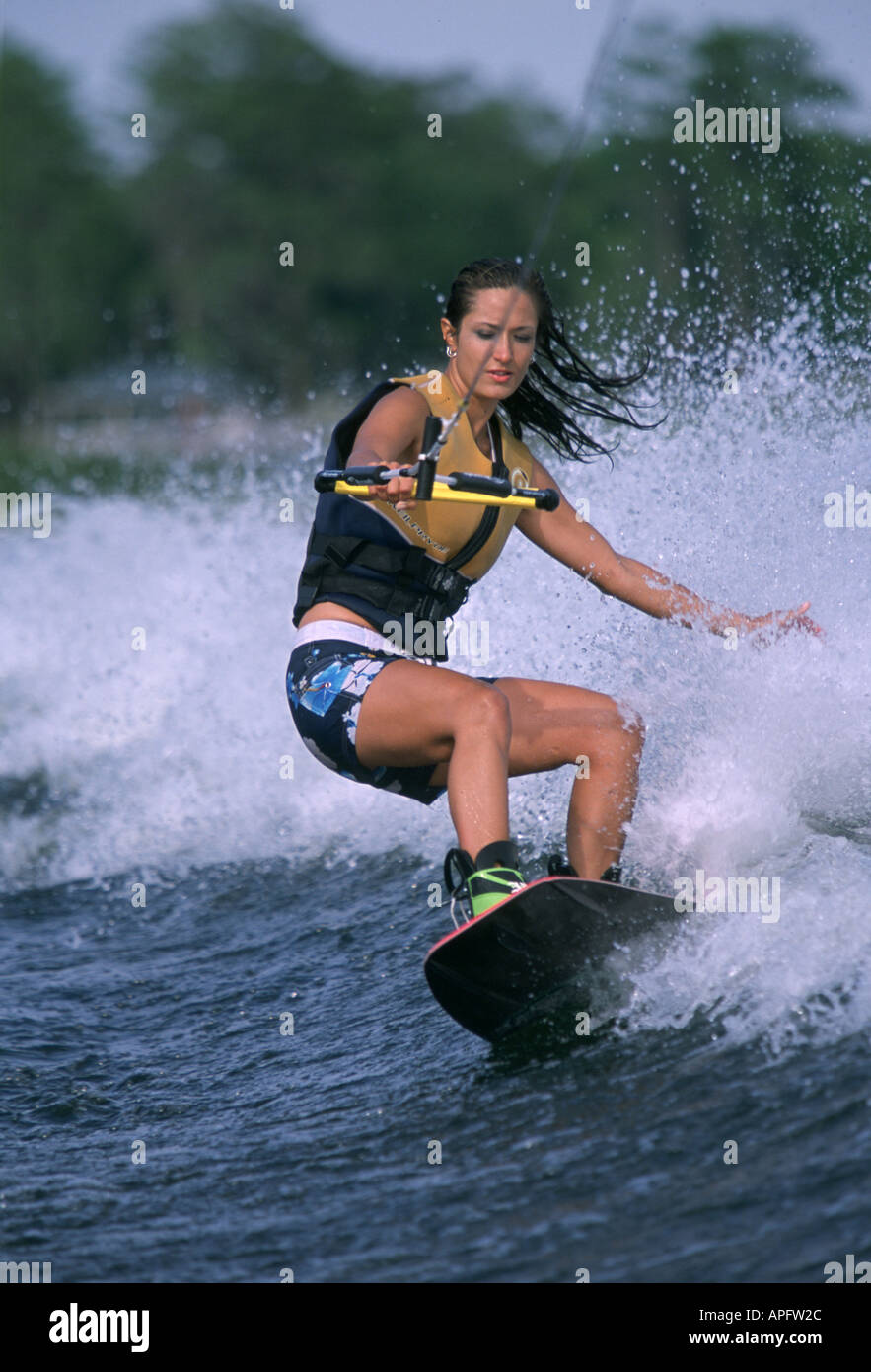 Woman wakeboarding action and concentration, Florida, USA Stock Photo ...