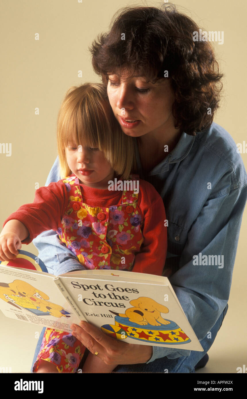 mother and toddler reading a book together Stock Photo - Alamy