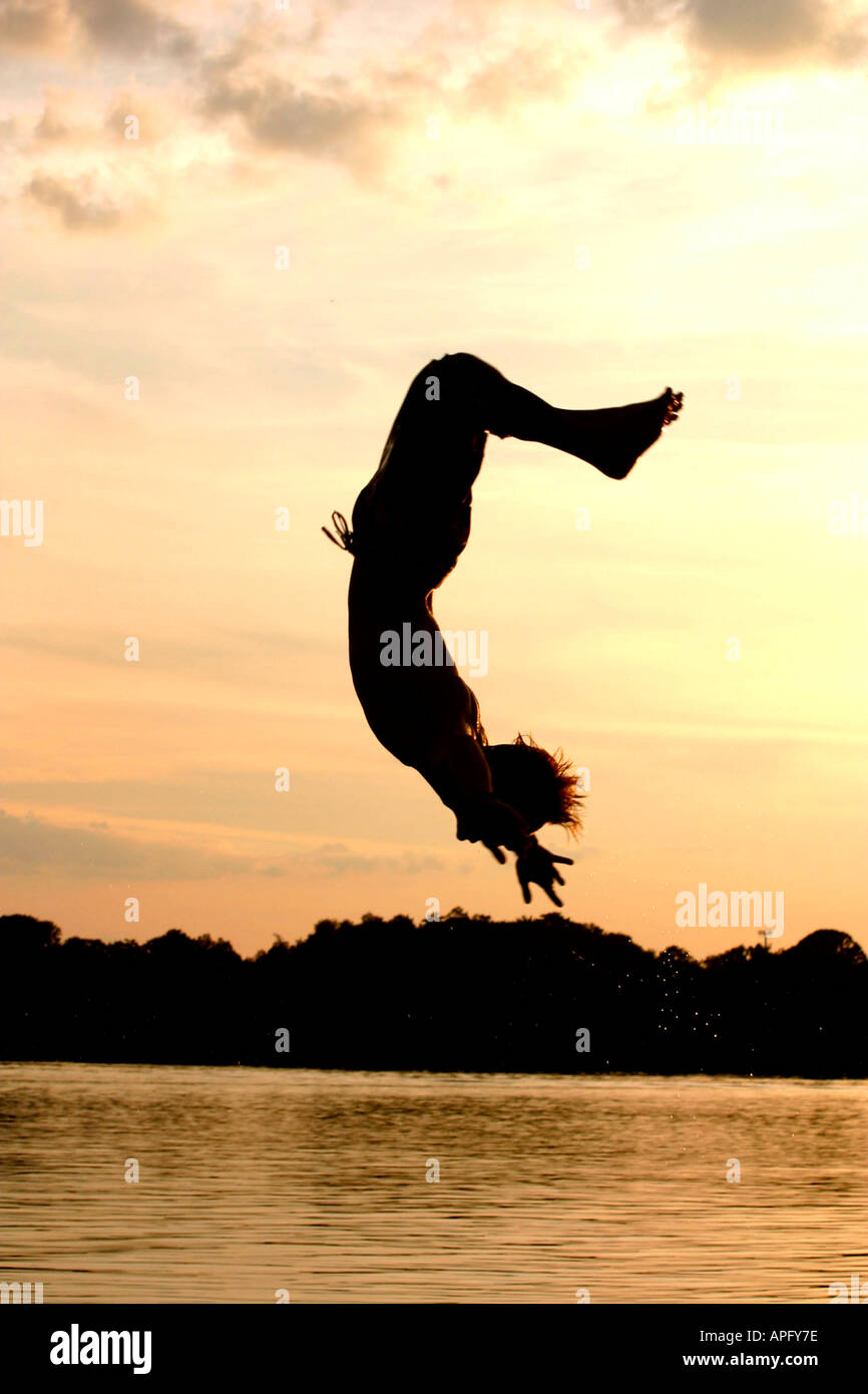Young men jumping from dock hi-res stock photography and images - Alamy