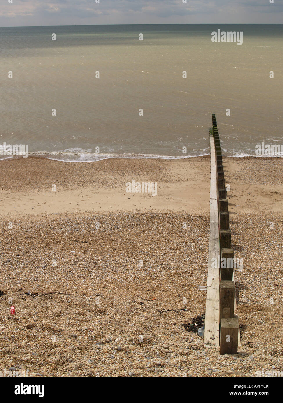 sunlight sea and pebble beach with tide out Stock Photo - Alamy