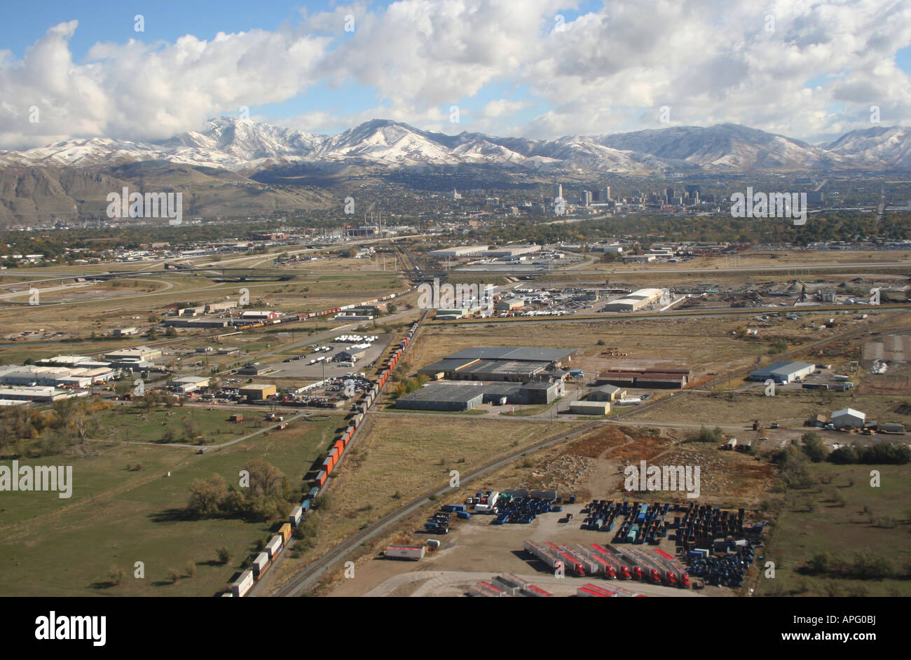aerial view of railway leading to Salt Lake City with snow capped ...