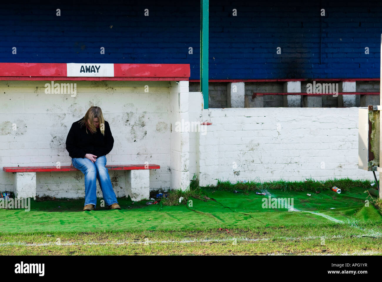 female football fan sitting in away dugout Stock Photo - Alamy