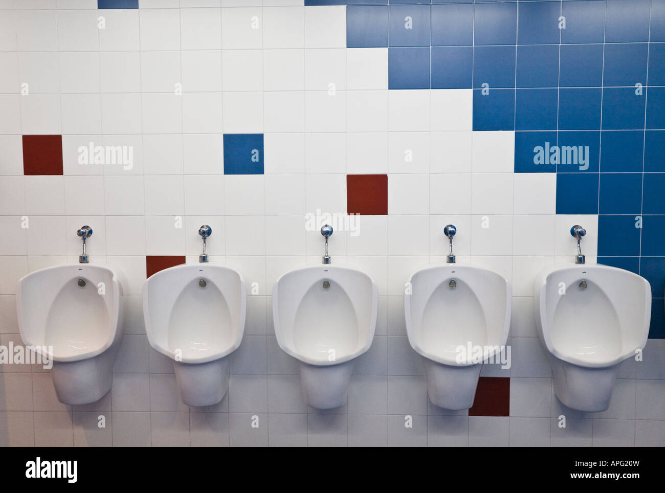 Row of urinals in public toilet Stock Photo - Alamy