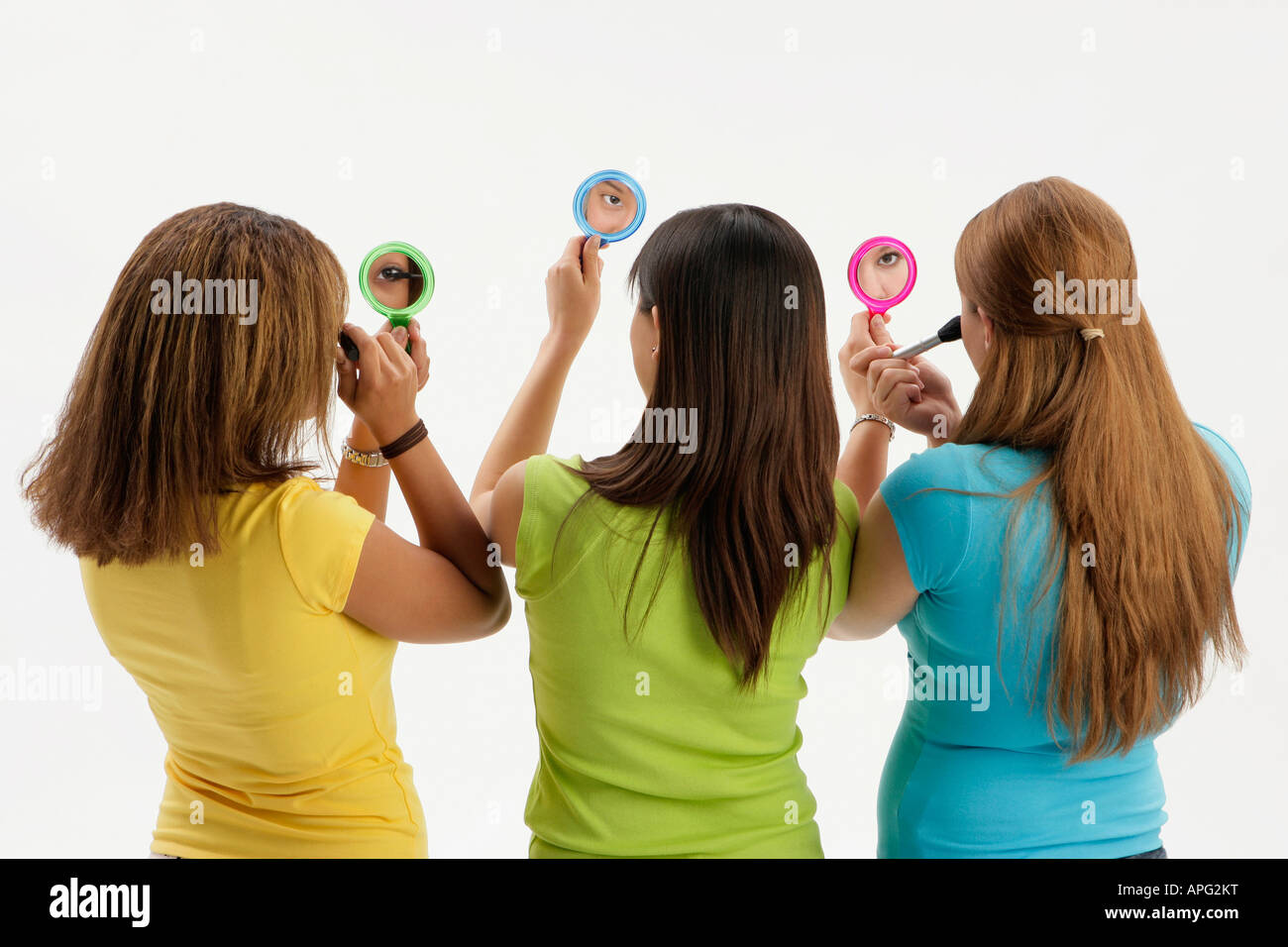 Three teen girls with compact mirrors Stock Photo - Alamy