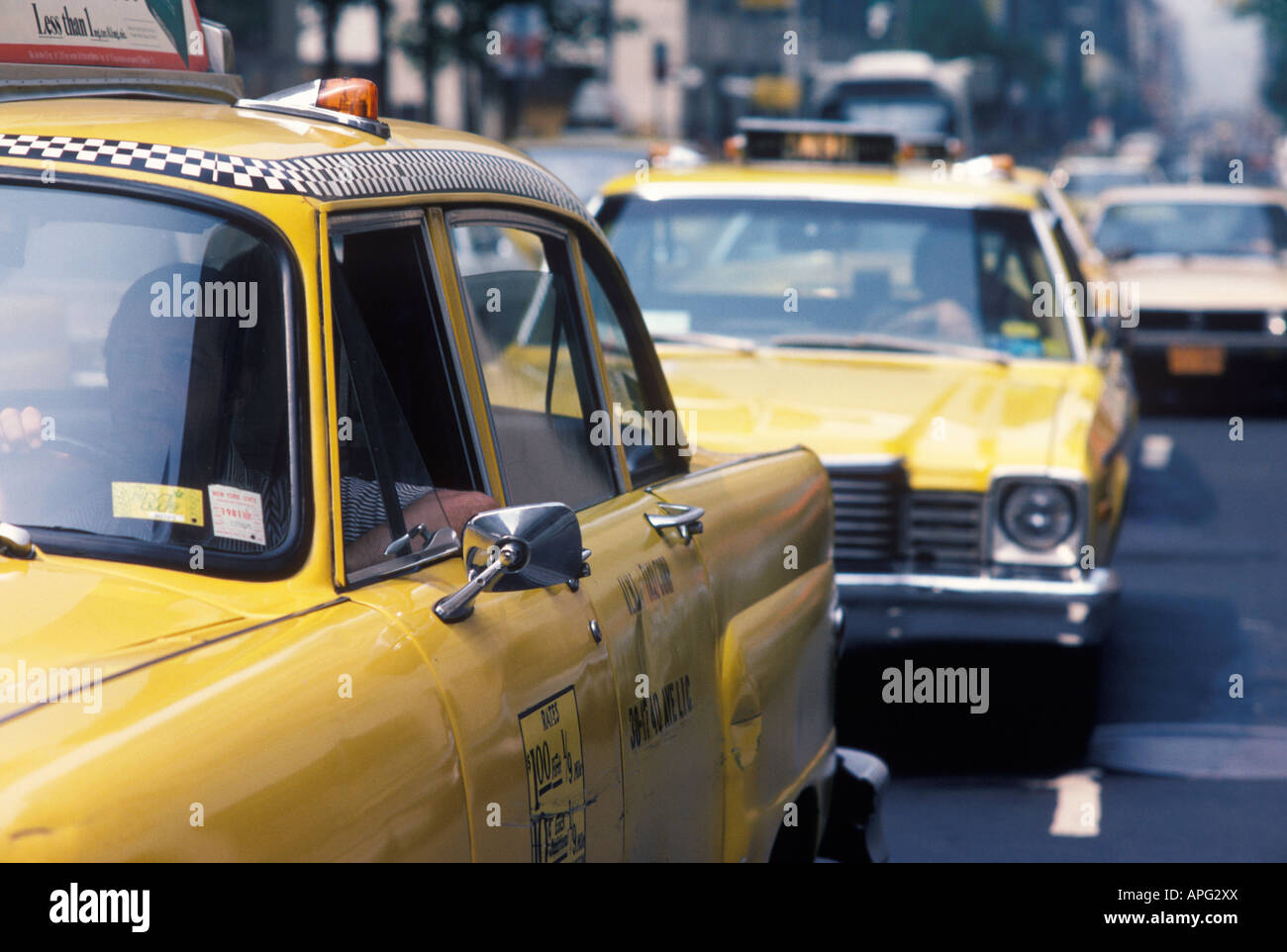 Old New York cabs driving along city street Stock Photo - Alamy