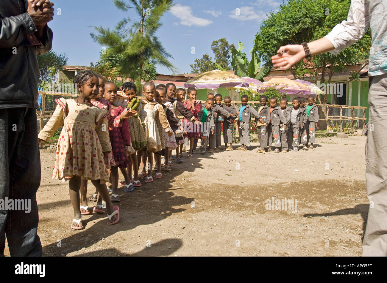 Children playing games in the playground of a charity run school Stock ...