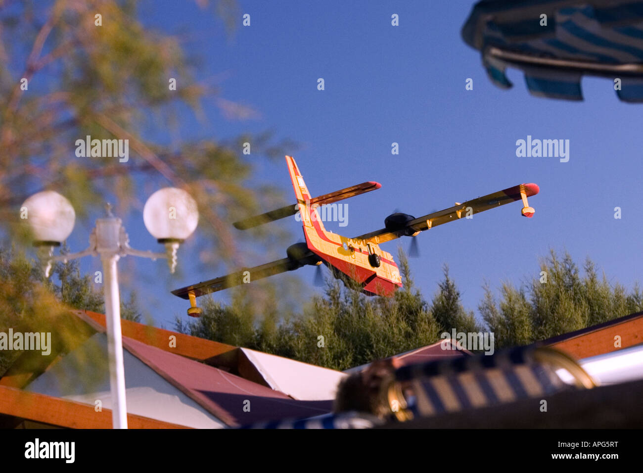 A Greek Firefighting plane on Samos swoops low over a hotel Stock Photo ...