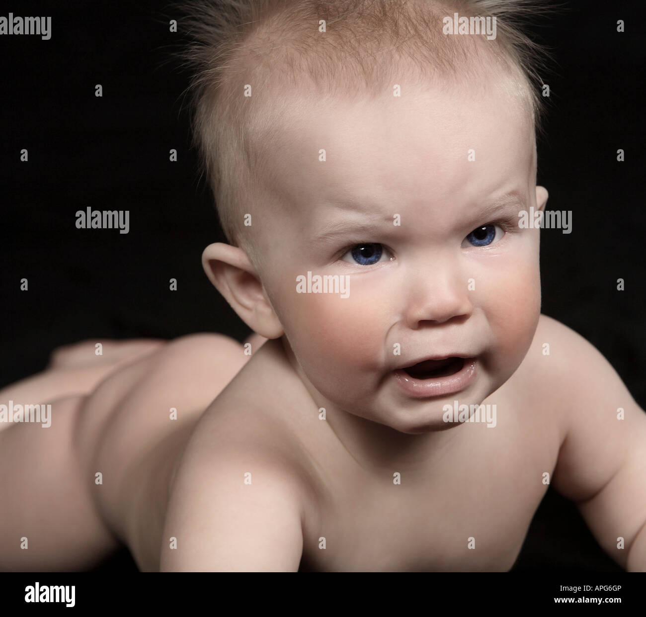 Baby girl infant frowning serious hi-res stock photography and images ...