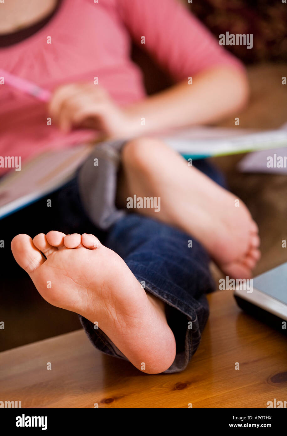 Girl feet on table hi-res stock photography and images - Alamy