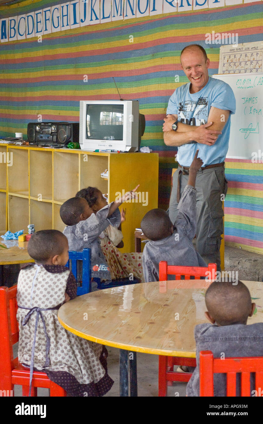 Kids put hands up classroom hi-res stock photography and images - Alamy