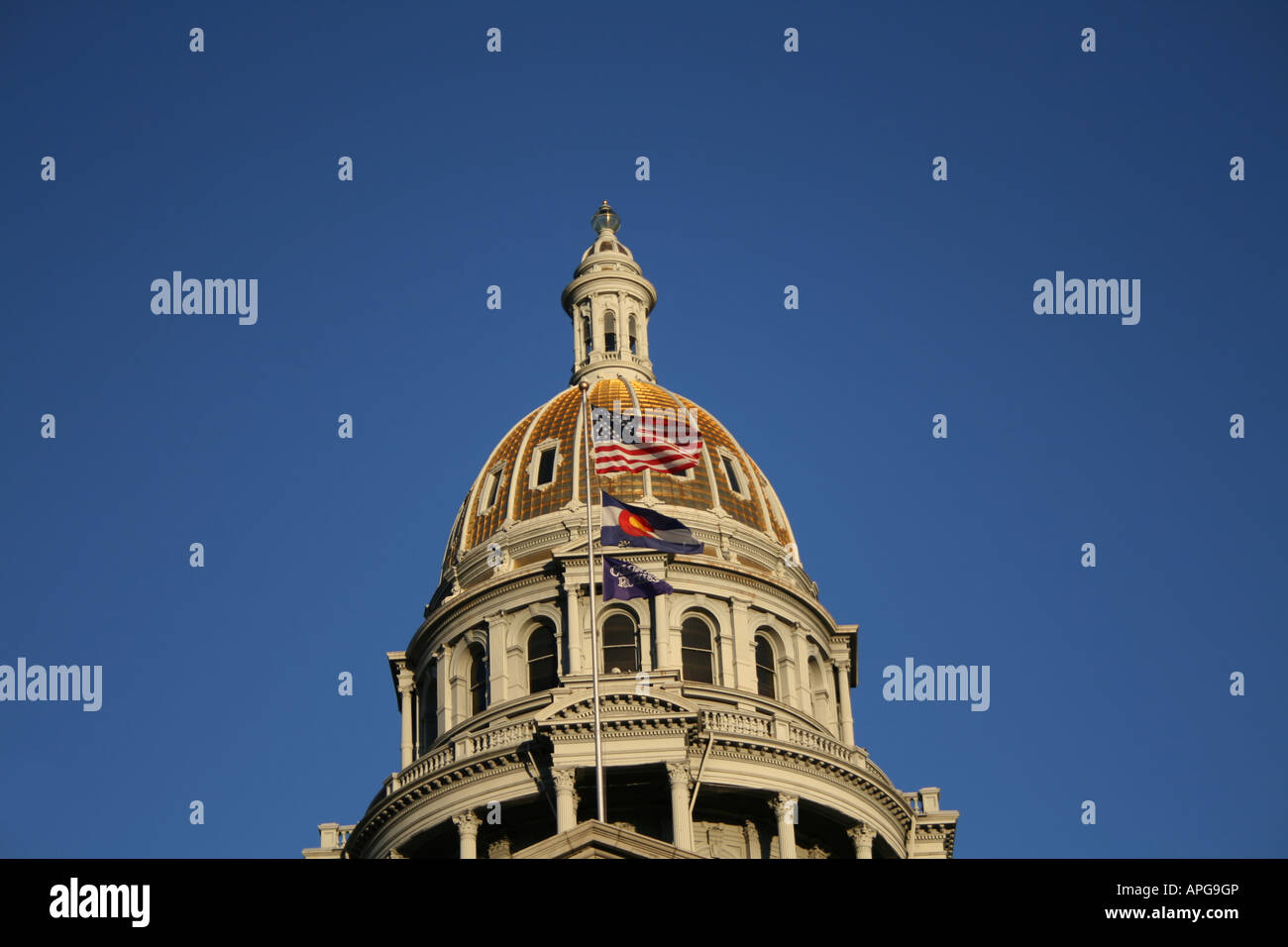Flags and golden dome of Colorado State Capitol Building in Denver ...