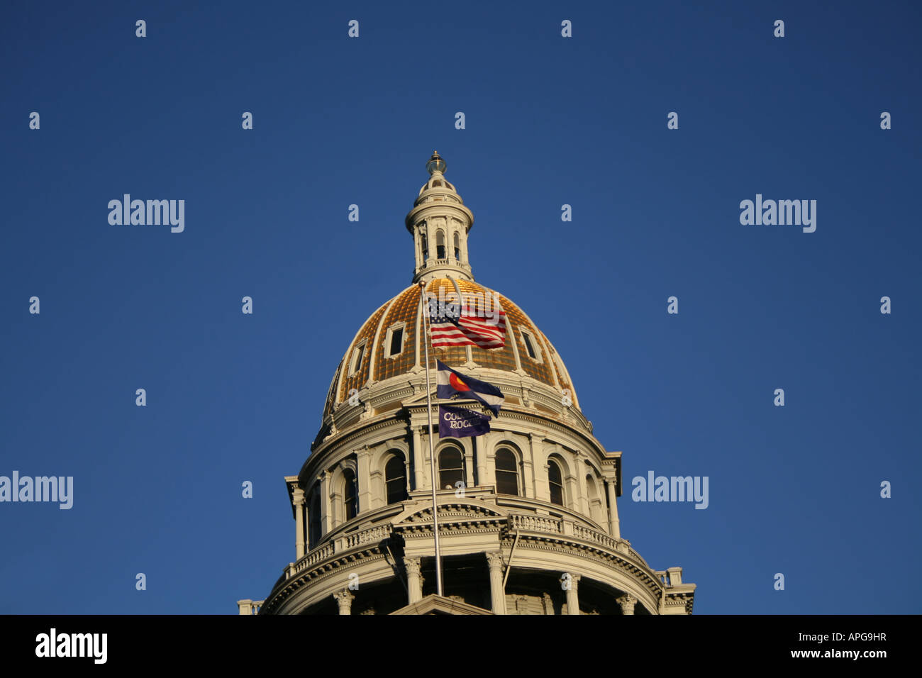 Flags and golden dome of Colorado State Capitol Building in Denver ...