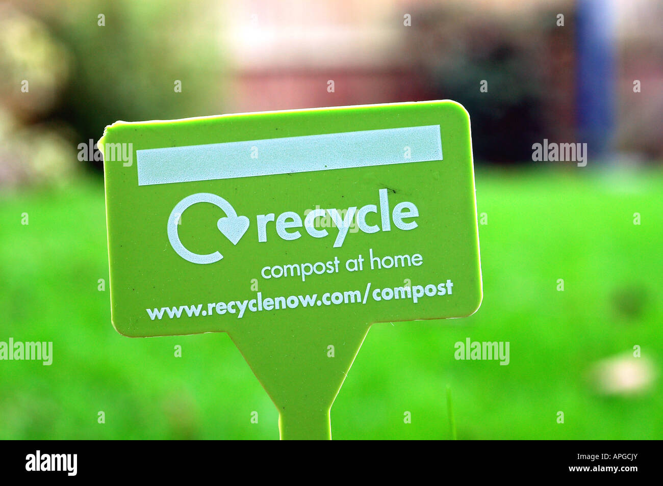 Recycle logo in a plant pot using compost Stock Photo - Alamy