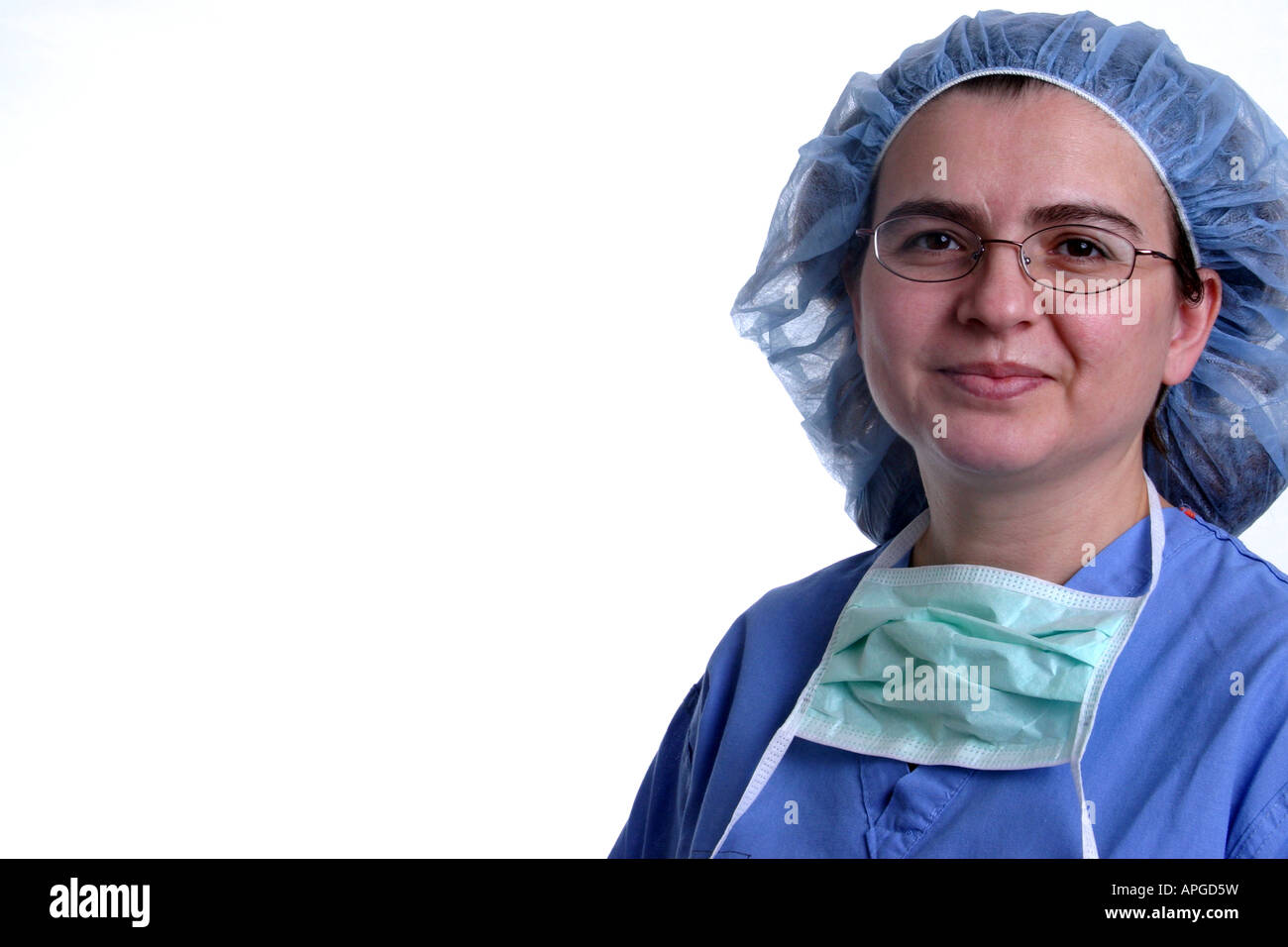 A nurse or surgeon wearing scrubs and surgical mask around her neck on ...