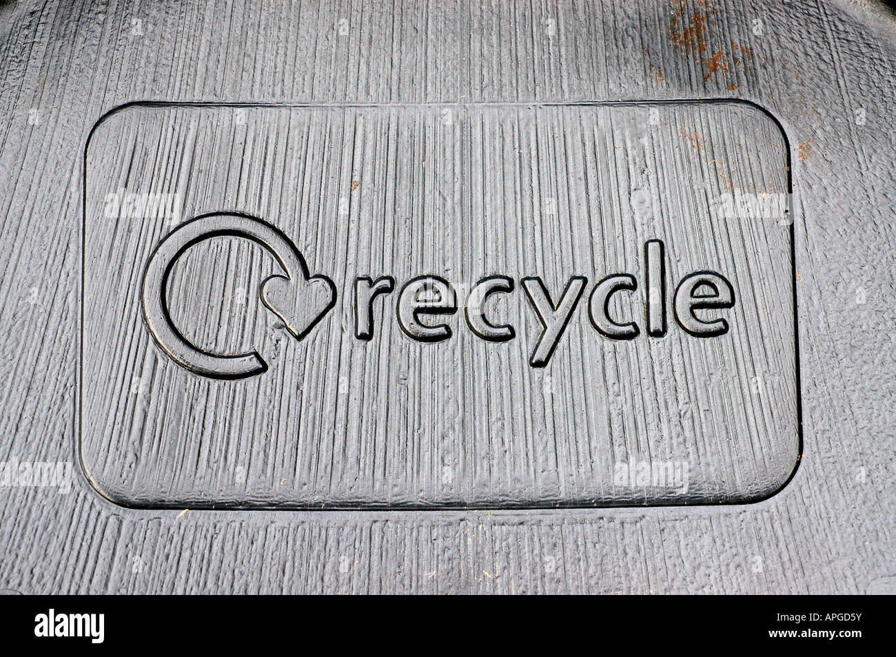 Recycle logo on the lid of a black plastic compost bin Stock Photo - Alamy