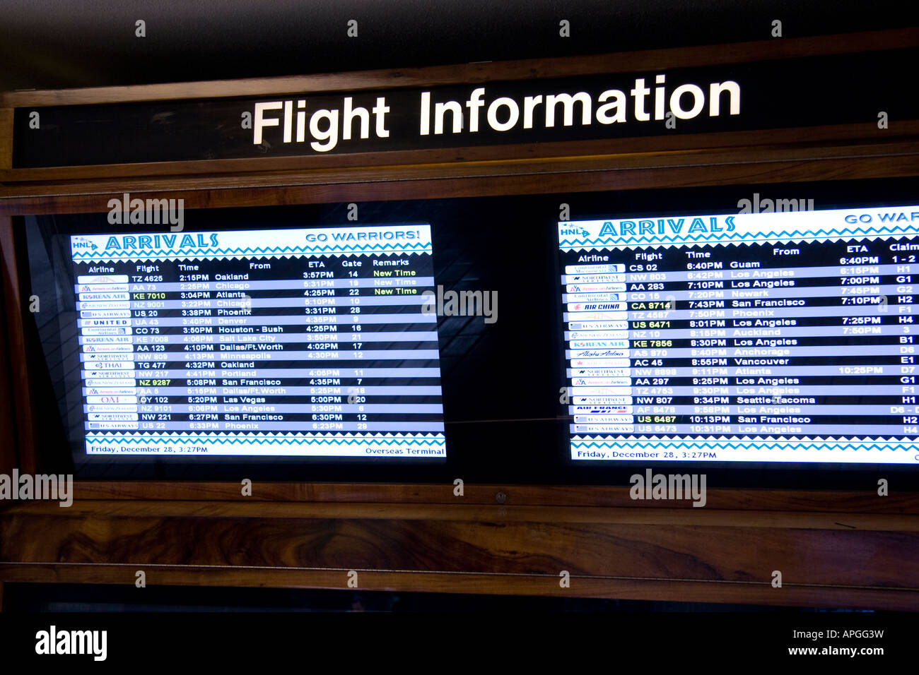 Airport flight arrivals monitors Stock Photo - Alamy