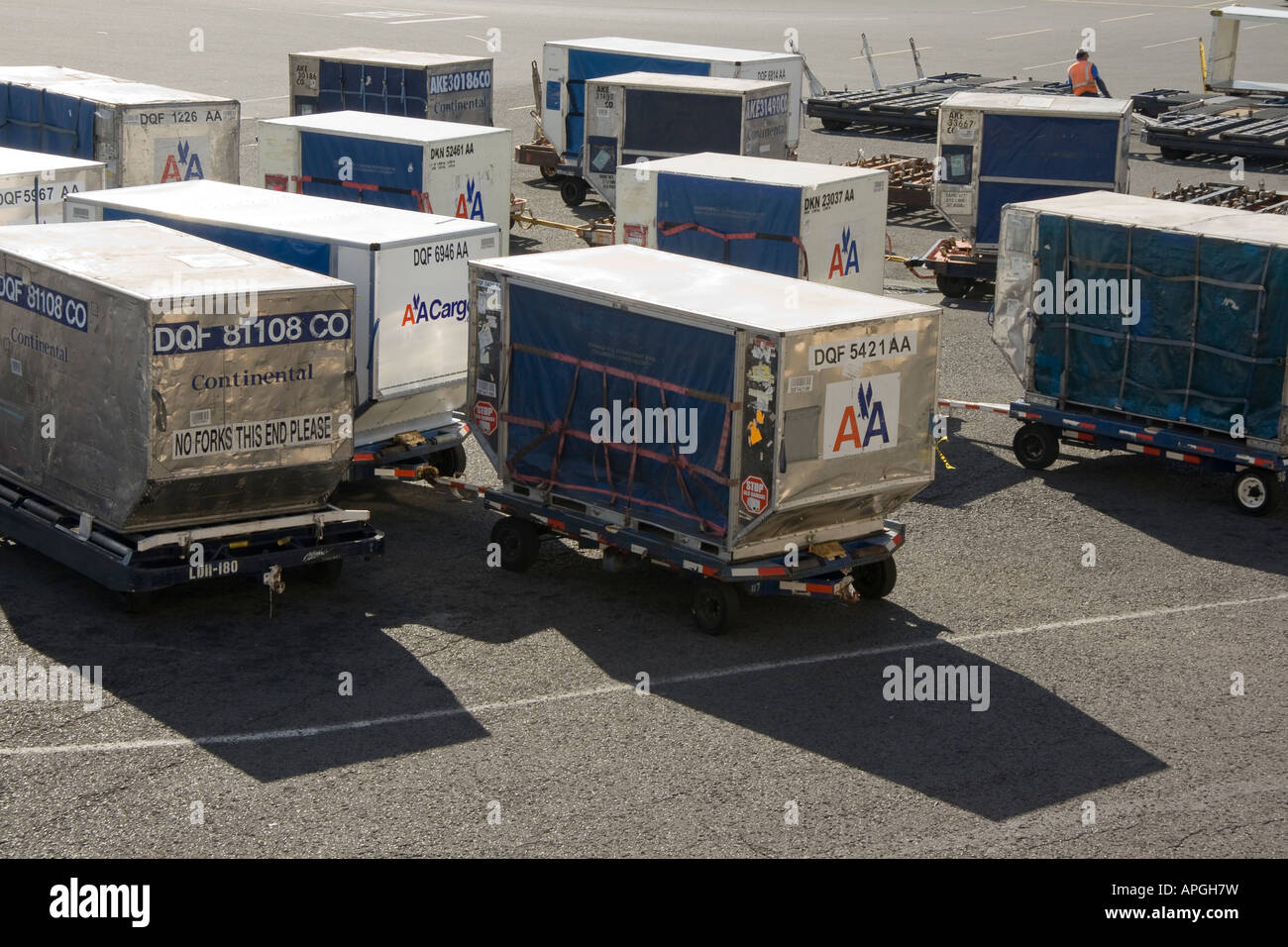 Airline cargo carts on tarmac Stock Photo - Alamy