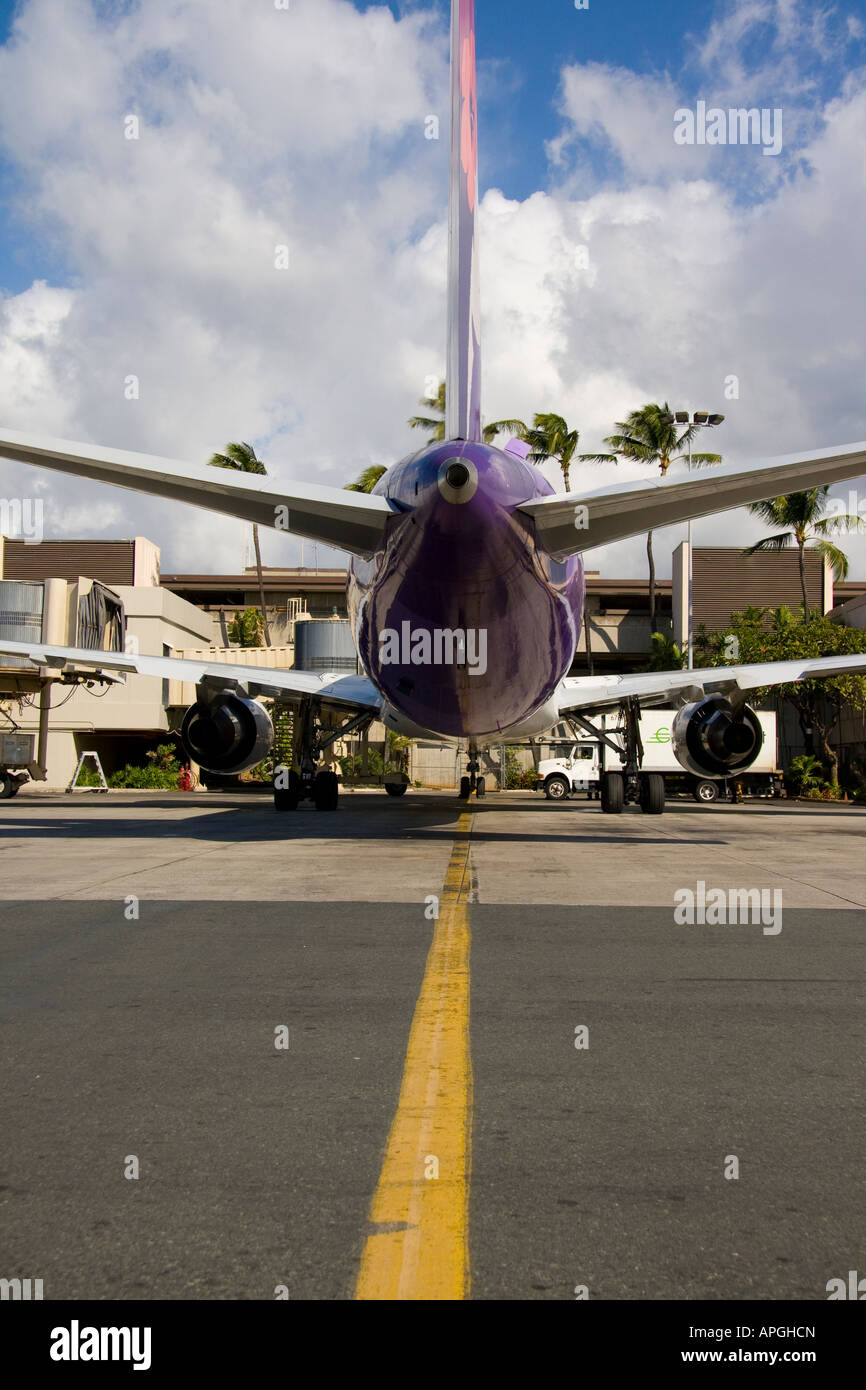 Tail of plane and yellow stripe on airport tarmac Stock Photo - Alamy