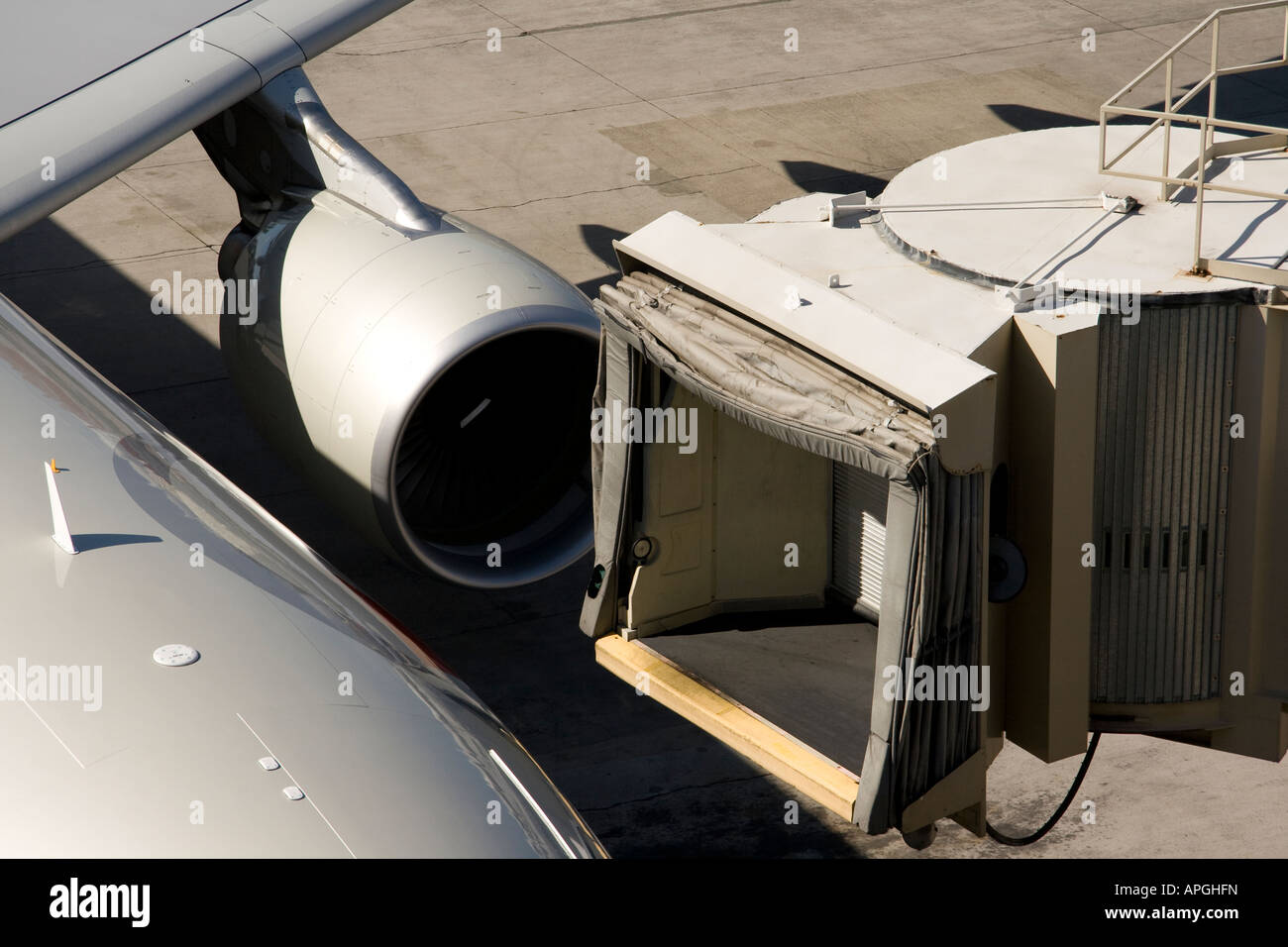 View from above, airplane and passenger loading ramp detaching from ...
