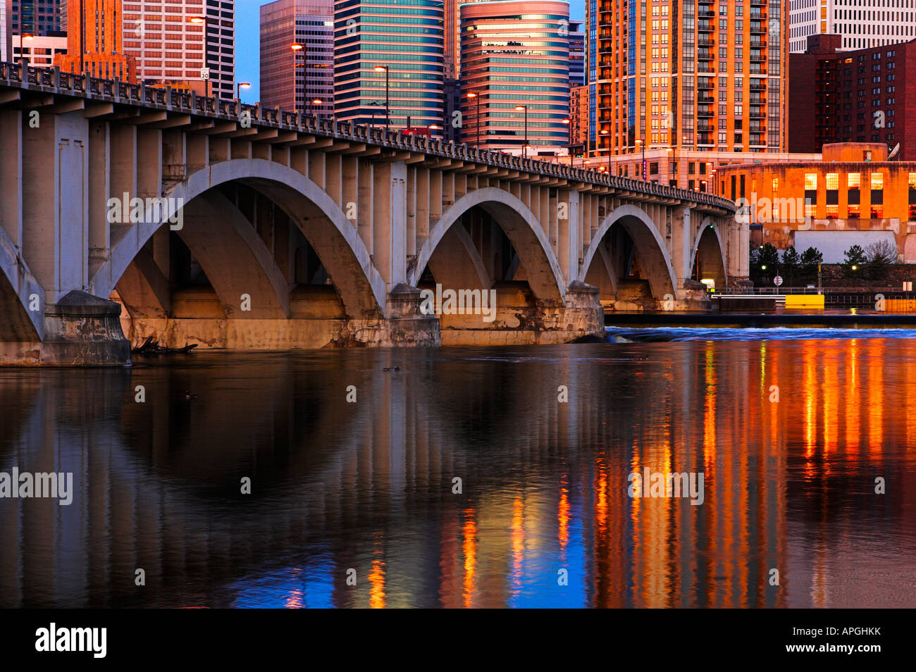 Downtown Minneapolis at sunrise viewed accross the Mississippi river ...
