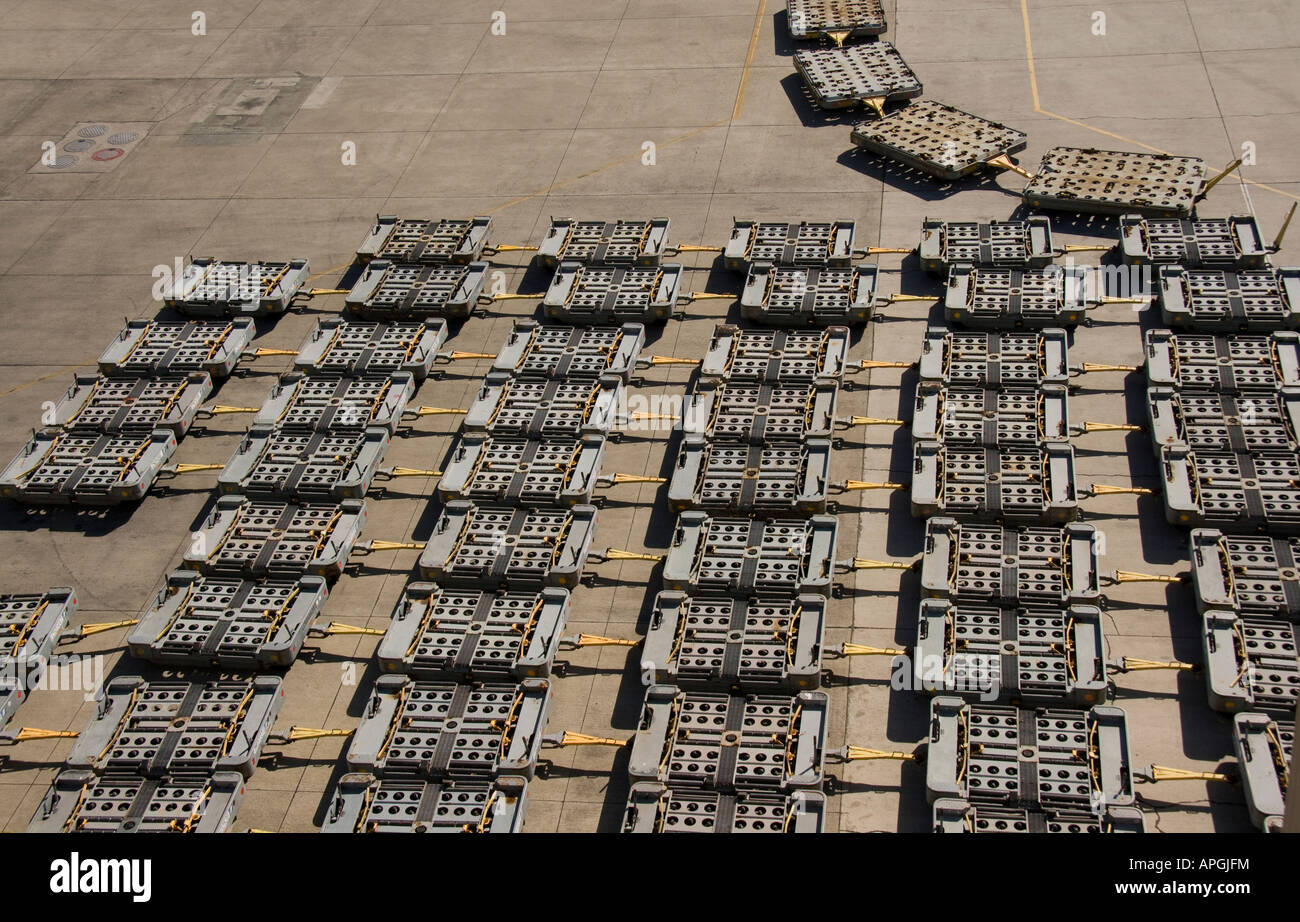 Freight loaders on airport tarmac Stock Photo - Alamy