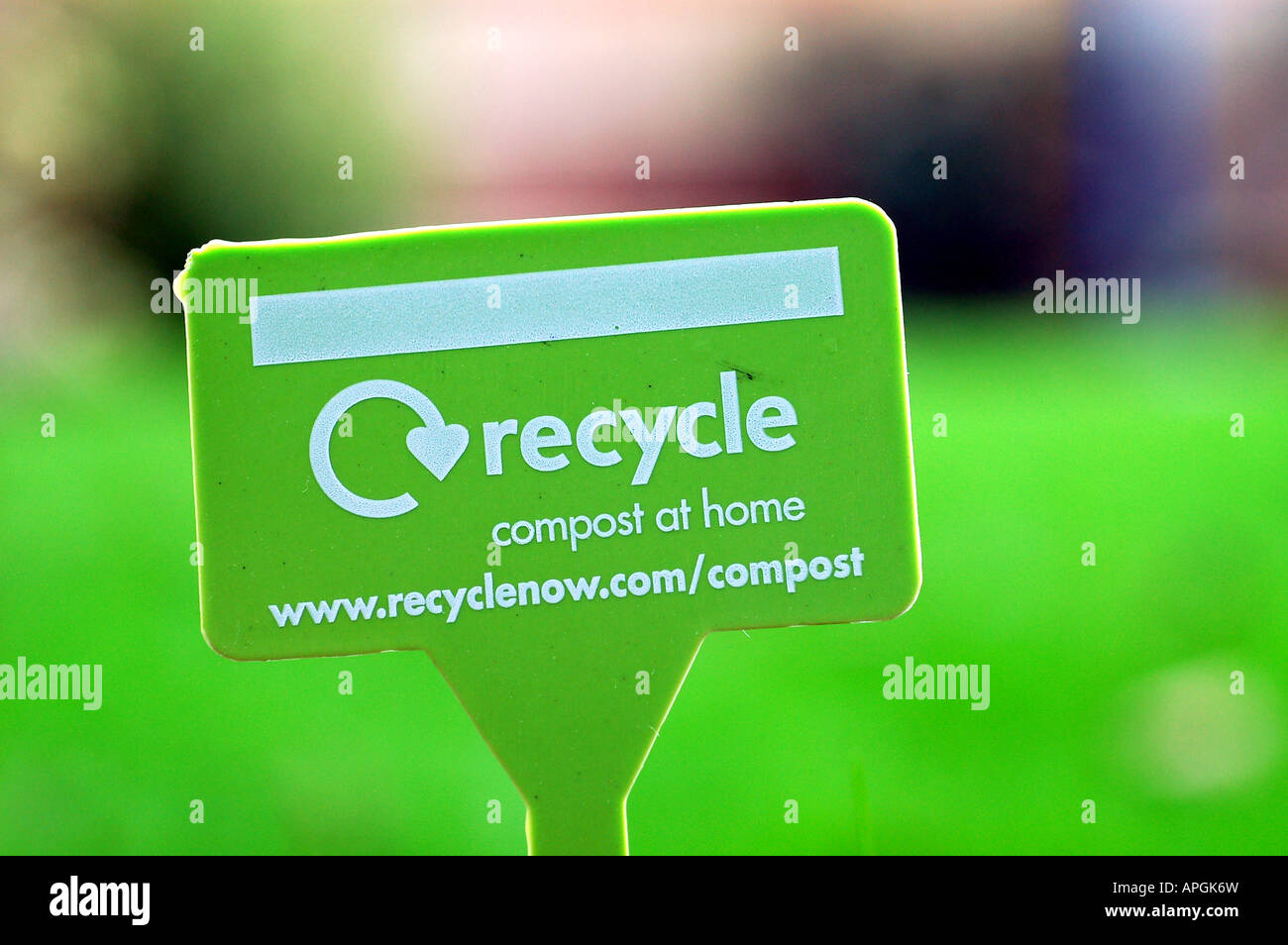 Recycle logo in a plant pot using compost Stock Photo - Alamy