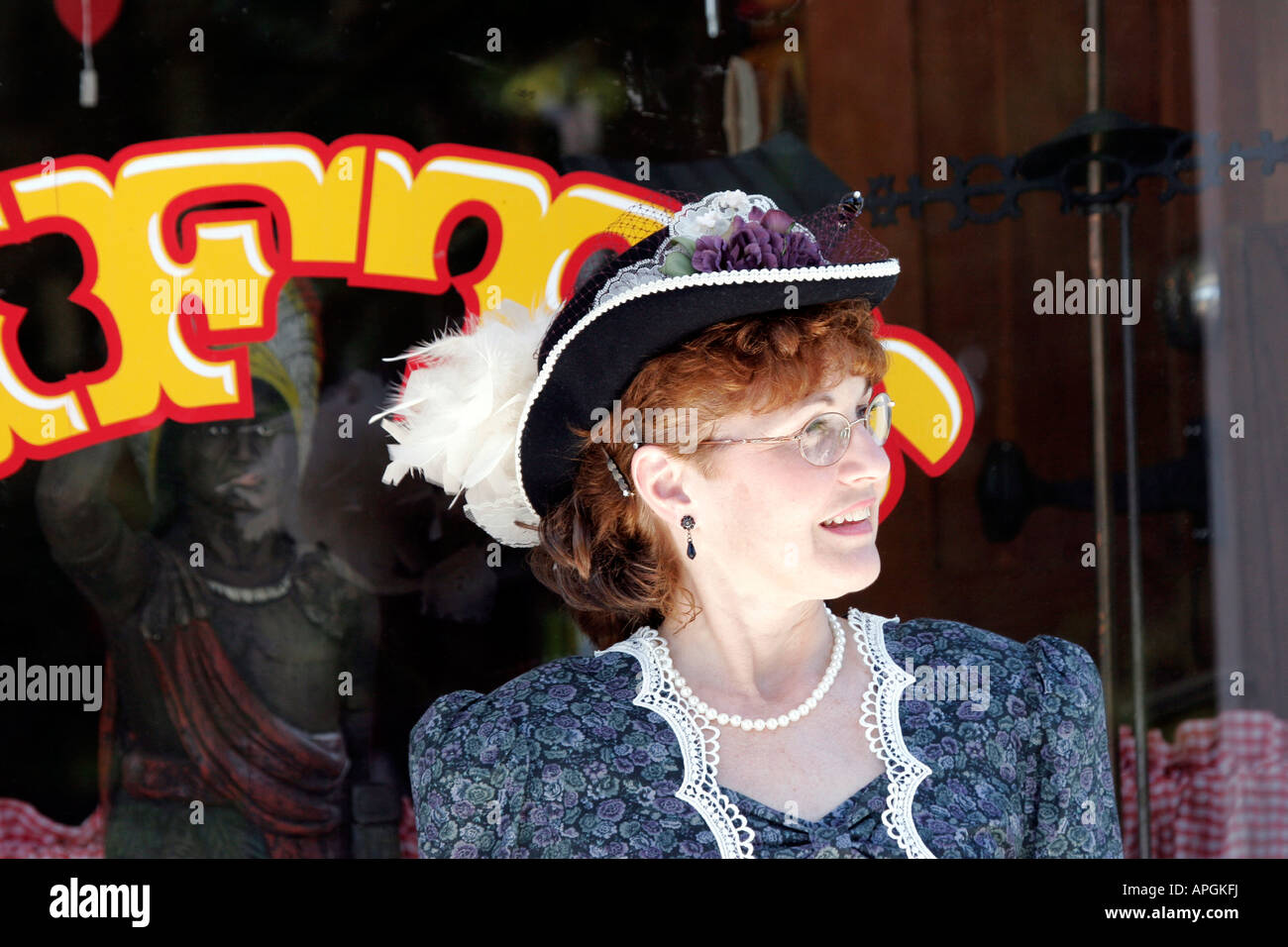 An 1850s reenactor standing in front of a old fashioned Candy and Gift ...
