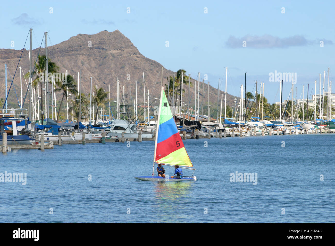 Topper sailboat with Diamond Head in the distance Stock Photo - Alamy