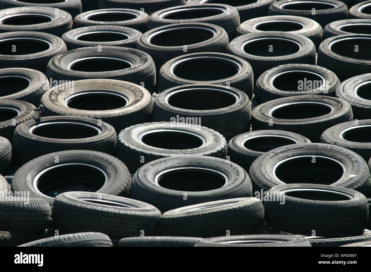 dump rubbish worn out used car tyres Stock Photo - Alamy