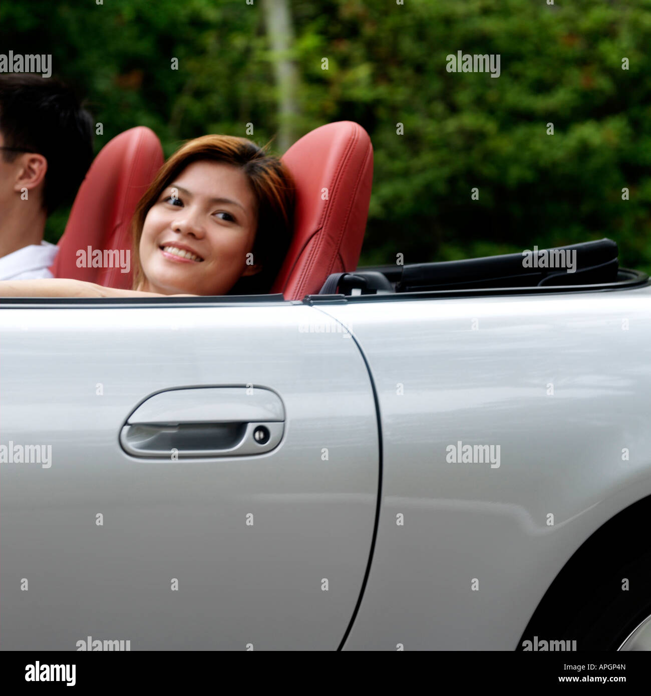 Woman in convertible, smiling Stock Photo - Alamy