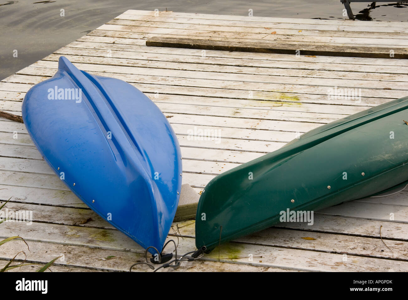 Two kayaks on pier Stock Photo - Alamy