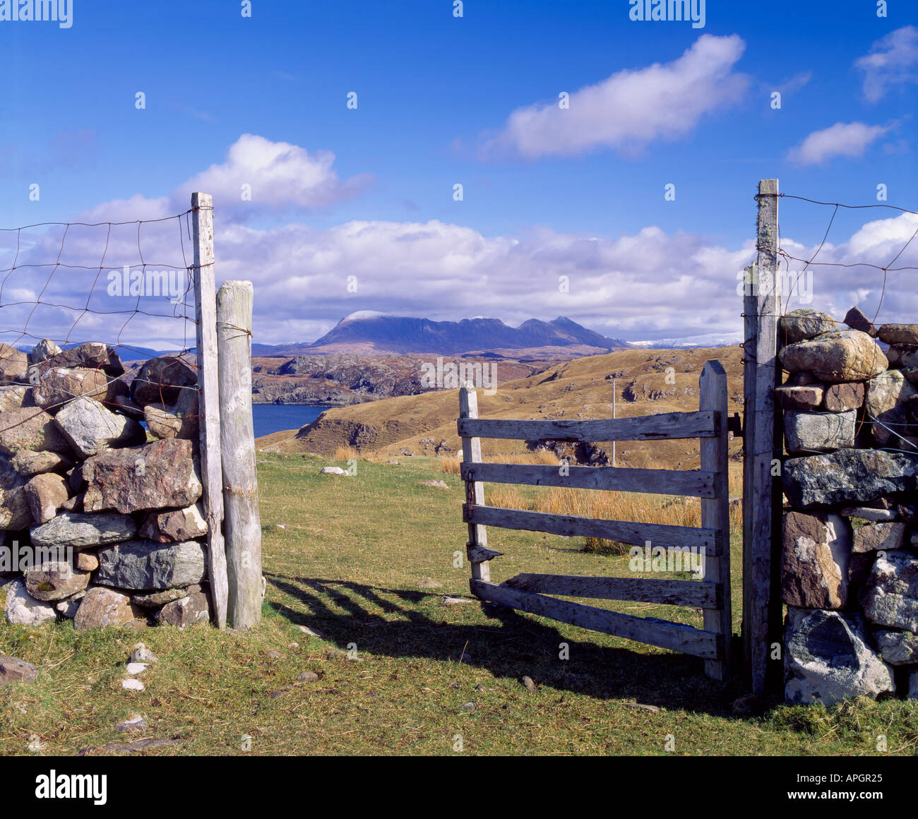 Quinag viewed through an open field gate on the Stoer Peninsula ...
