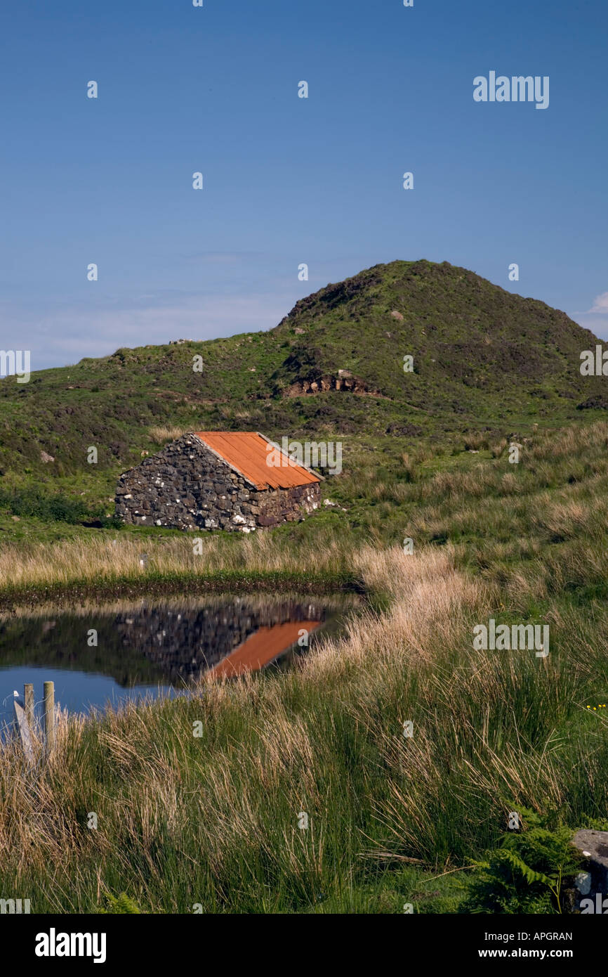 Scottish byre by a loch Stock Photo - Alamy