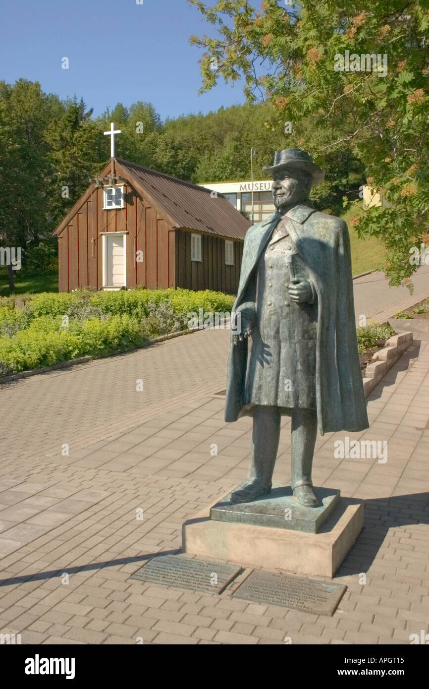 Statue of Nonni by traditional timber church and museum Akureyri ...