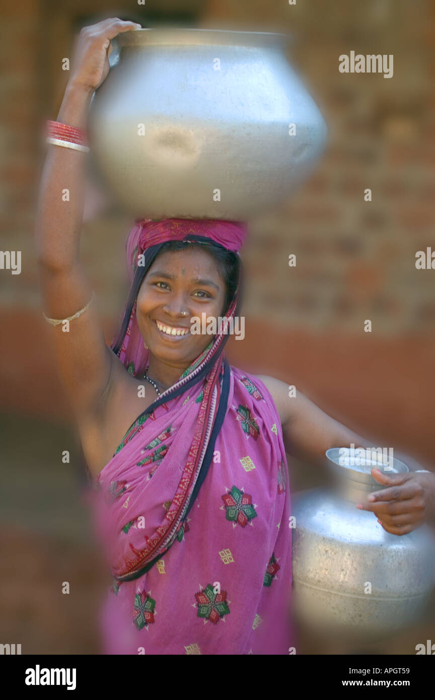 Woman carrying water jar Orissa India Stock Photo - Alamy