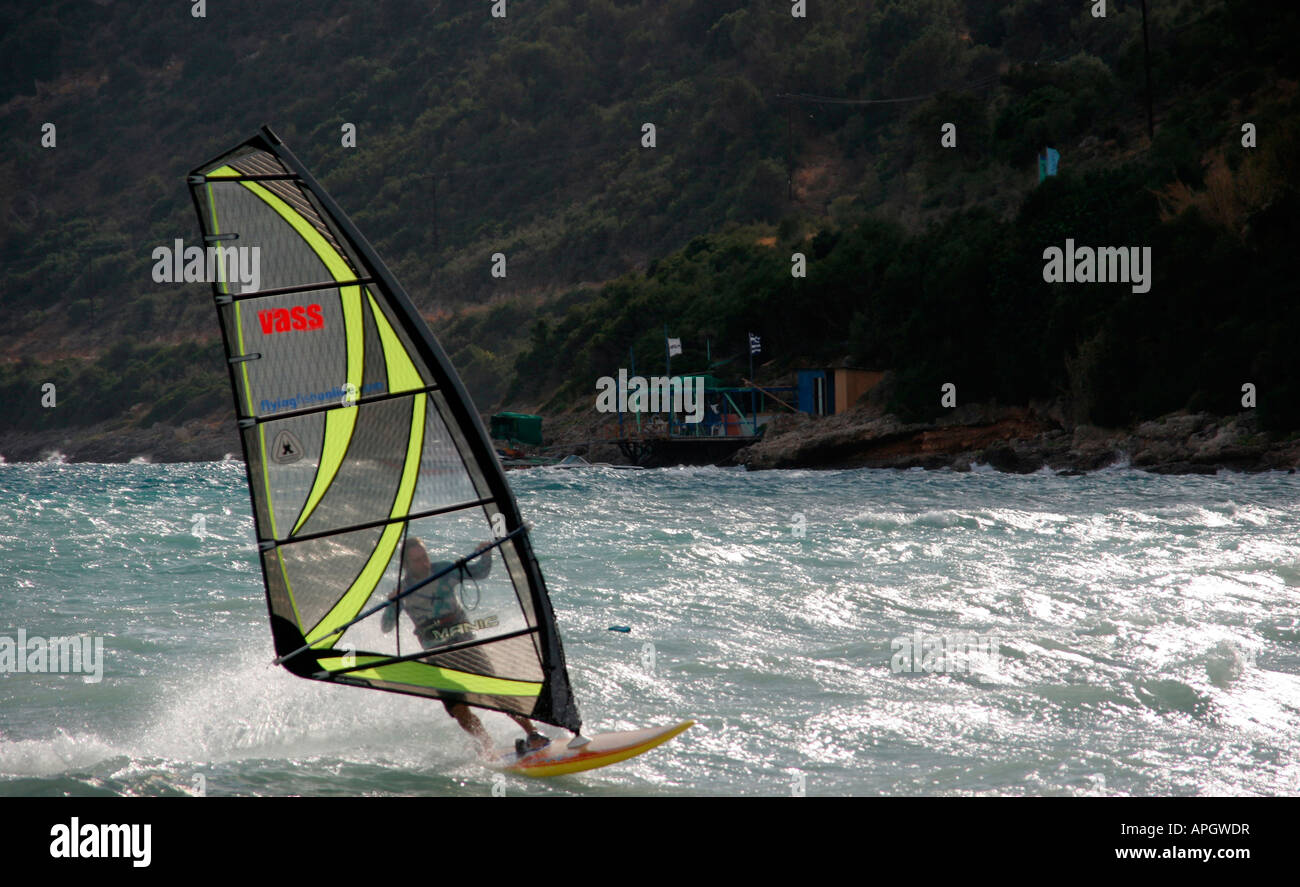 A windsurfer gybing at Vassiliki on the island of Lefkas in Greece ...