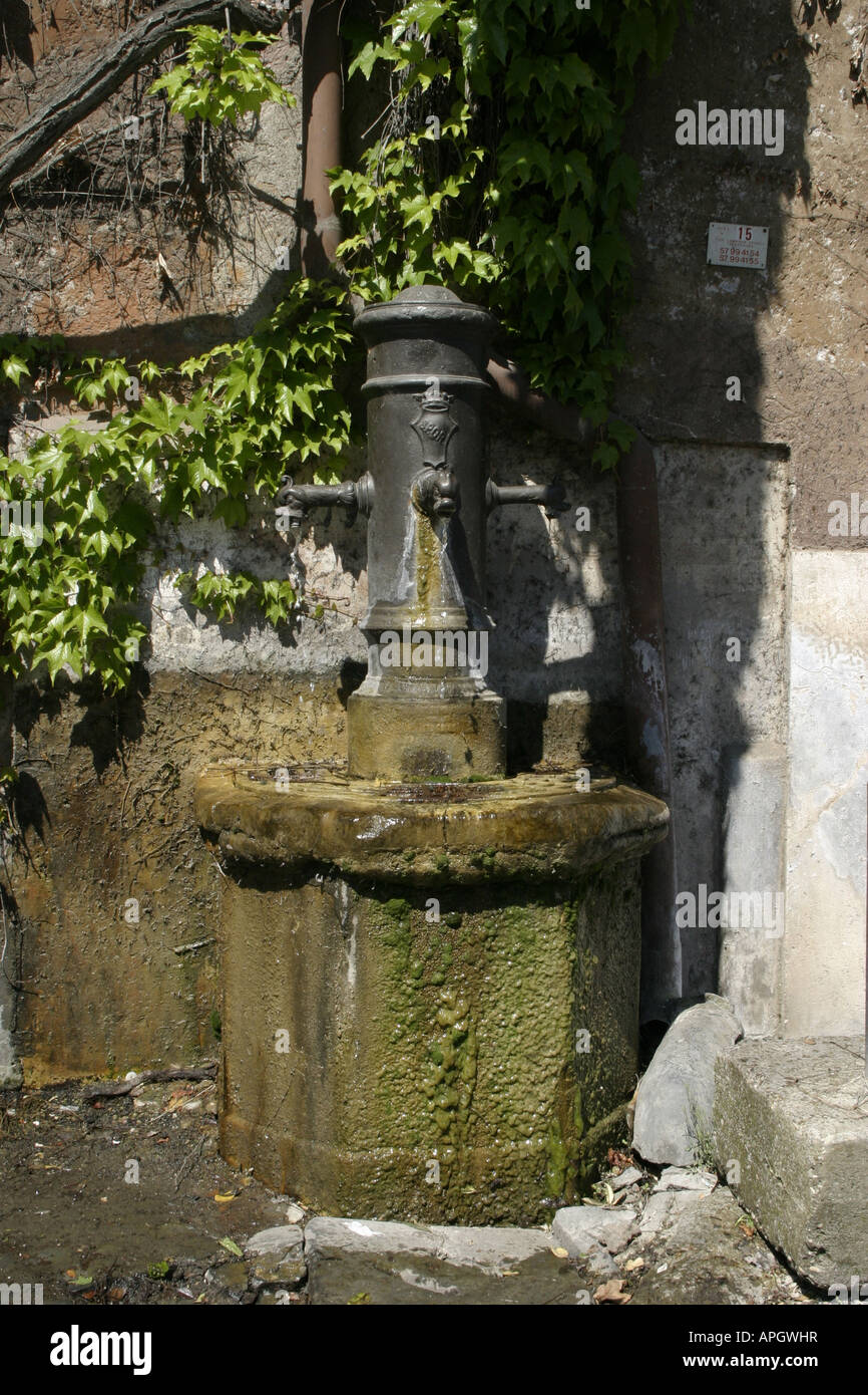 old water pump in a square in Rome, Italy Stock Photo - Alamy