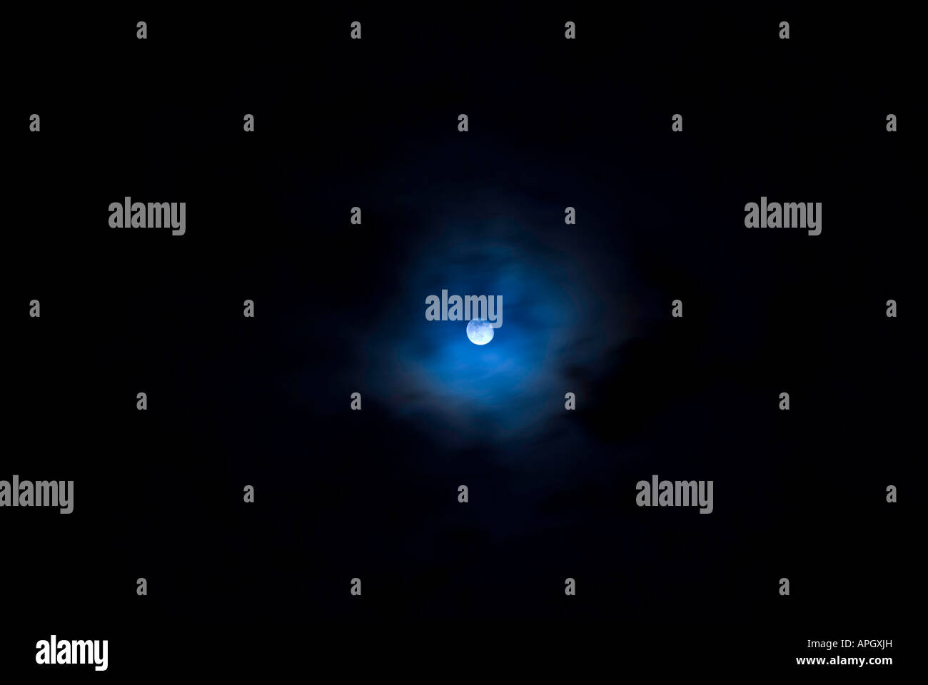 Windy night sky showing moon through heavy cloud cover Stock Photo - Alamy