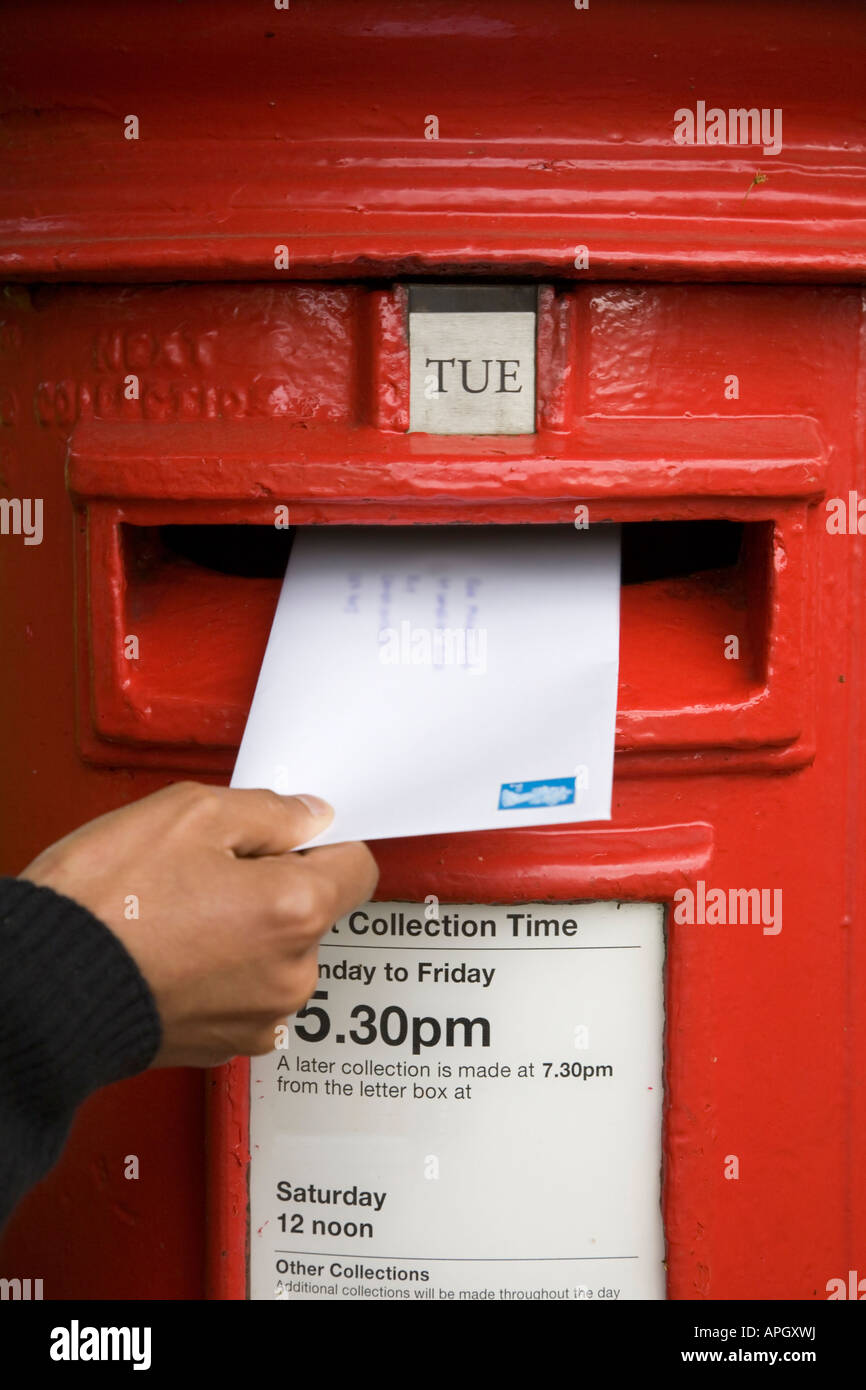 Woman posting letter in post hi-res stock photography and images - Alamy