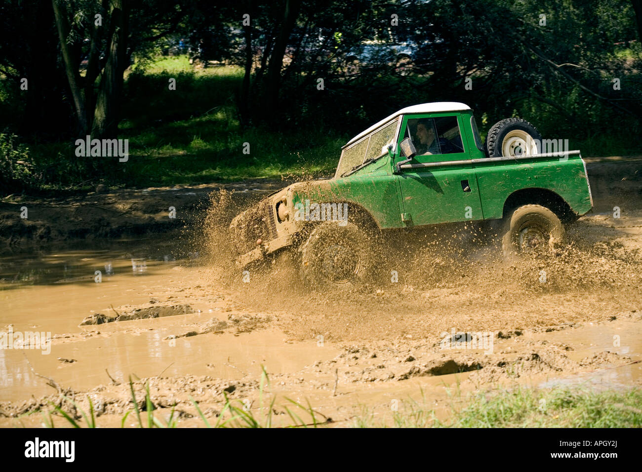 Landrover Series 3 going through deep mud Stock Photo - Alamy