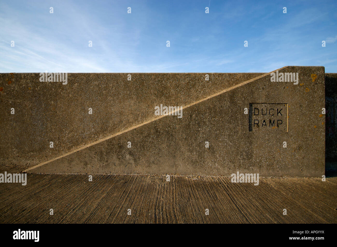 A concrete sea wall with a Duck Ramp built into it to allow wildfowl to ...