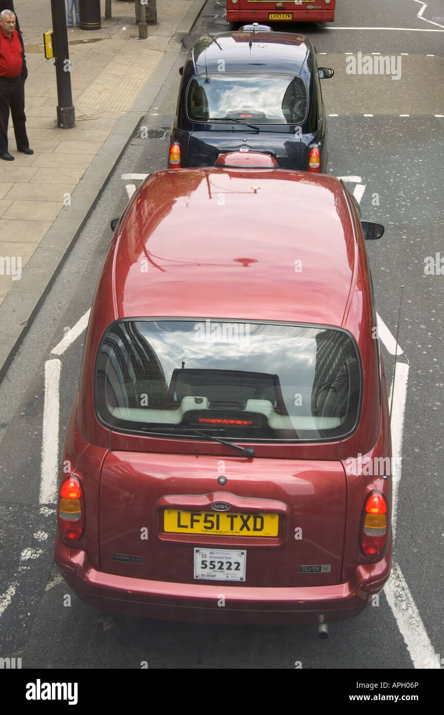 Two London taxis on Oxford Street UK Stock Photo - Alamy