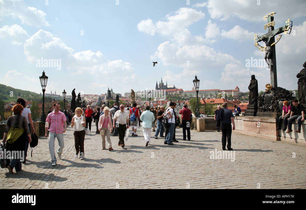 Crowds in front of the statue of Christ on the cross, Charles Bridge ...
