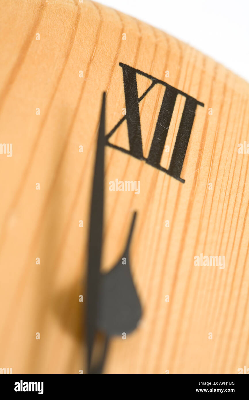 Closeup of a wooden clock with hands approaching midnight Stock Photo ...